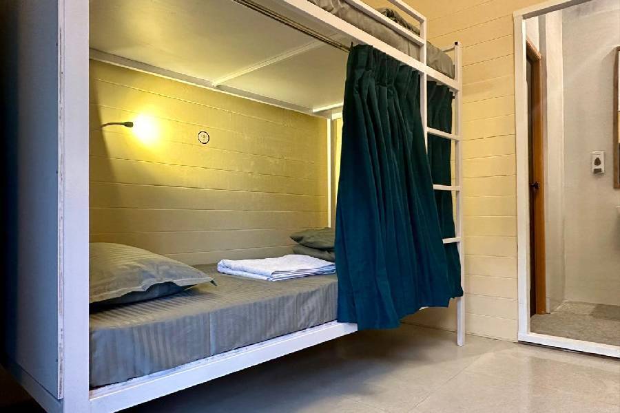 A Bunk Bed in Deluxe 4 Bed Male Dormitory Room with Attached Washroom | Coco Hostel